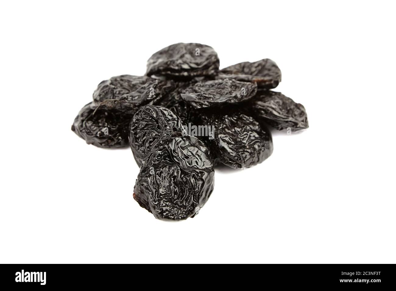 Prunes, dry plums isolated on white background. Heap of dried fruits ...