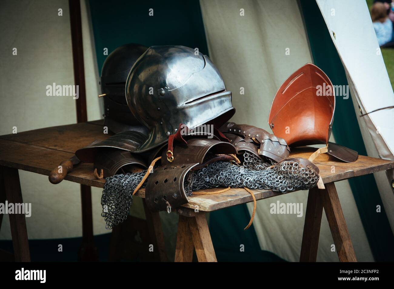 Clothing and tools of a medieval knight on the table Stock Photo - Alamy