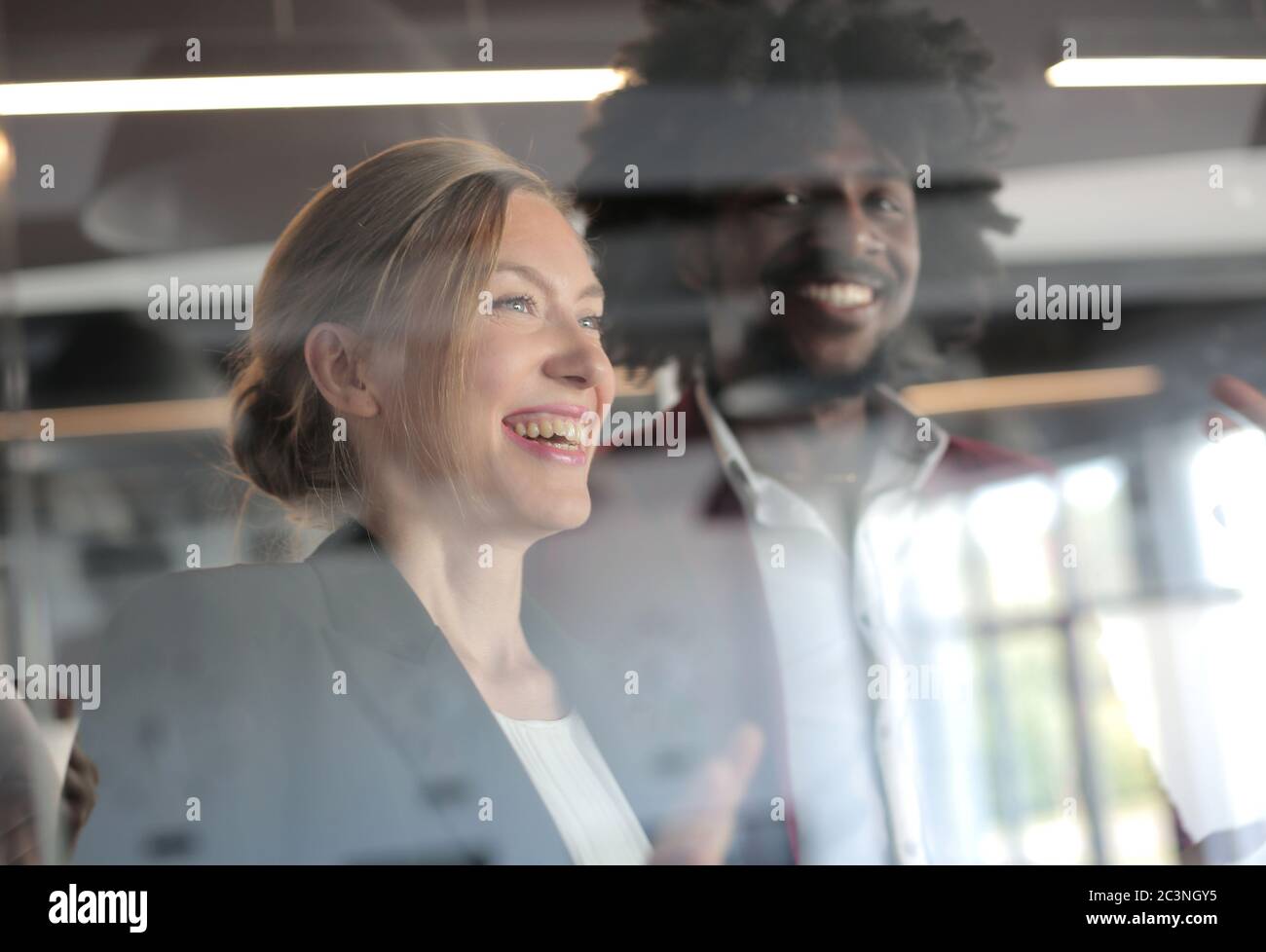 Successful female team leader in a formal outfit presenting the new ...