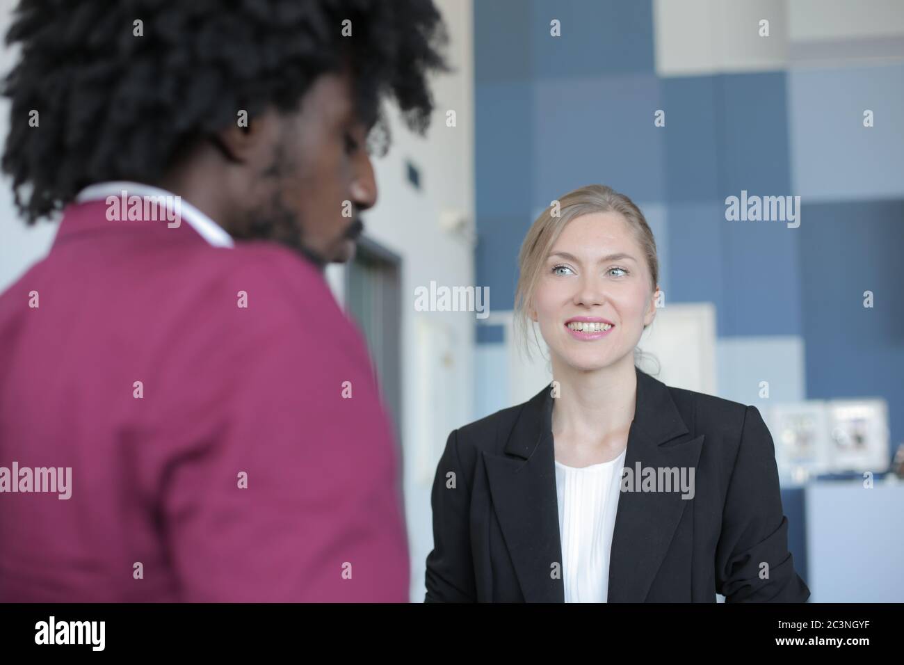 Successful female team leader in a formal outfit presenting the new ...