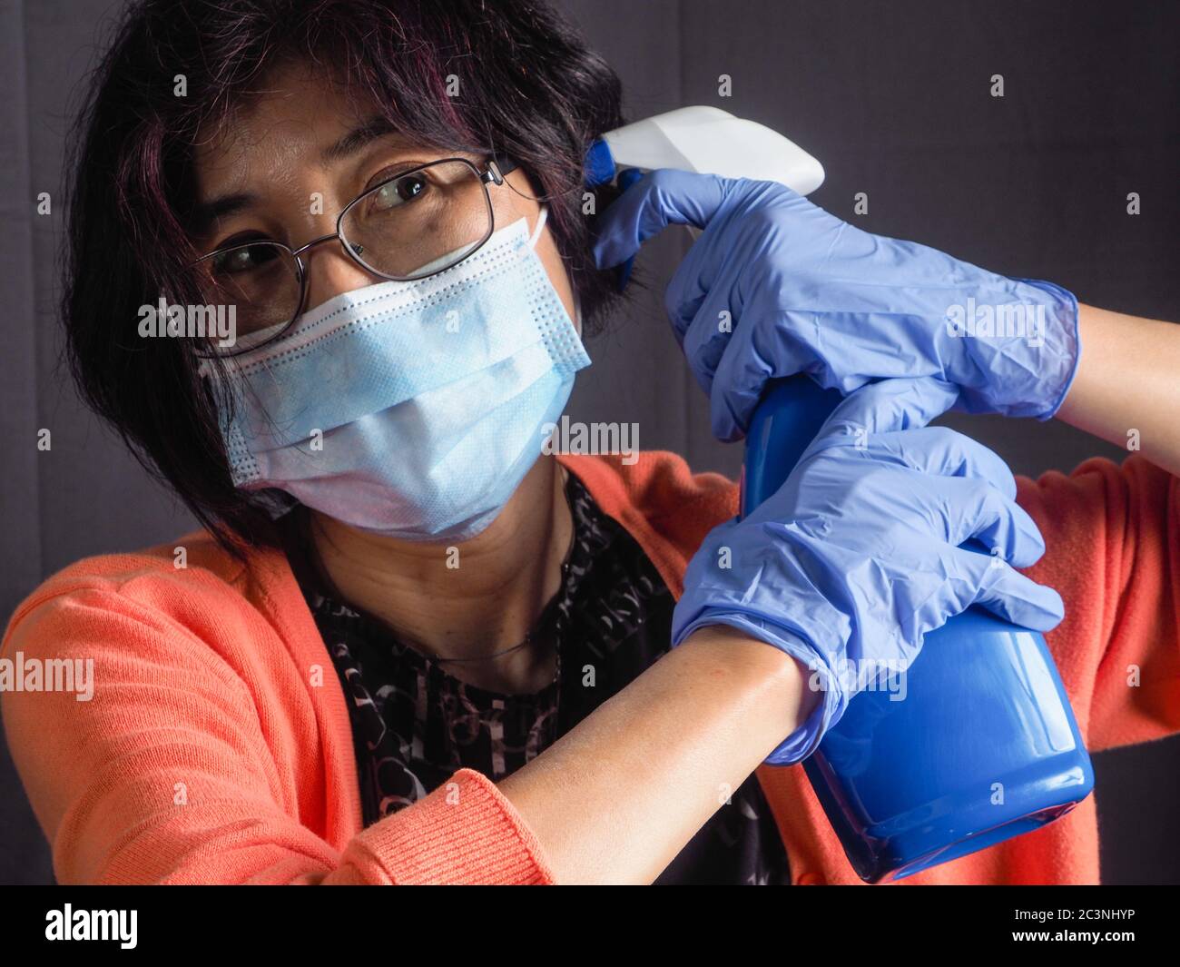 funny humorous adult asian 40s 50s woman wearing protection surgical ...