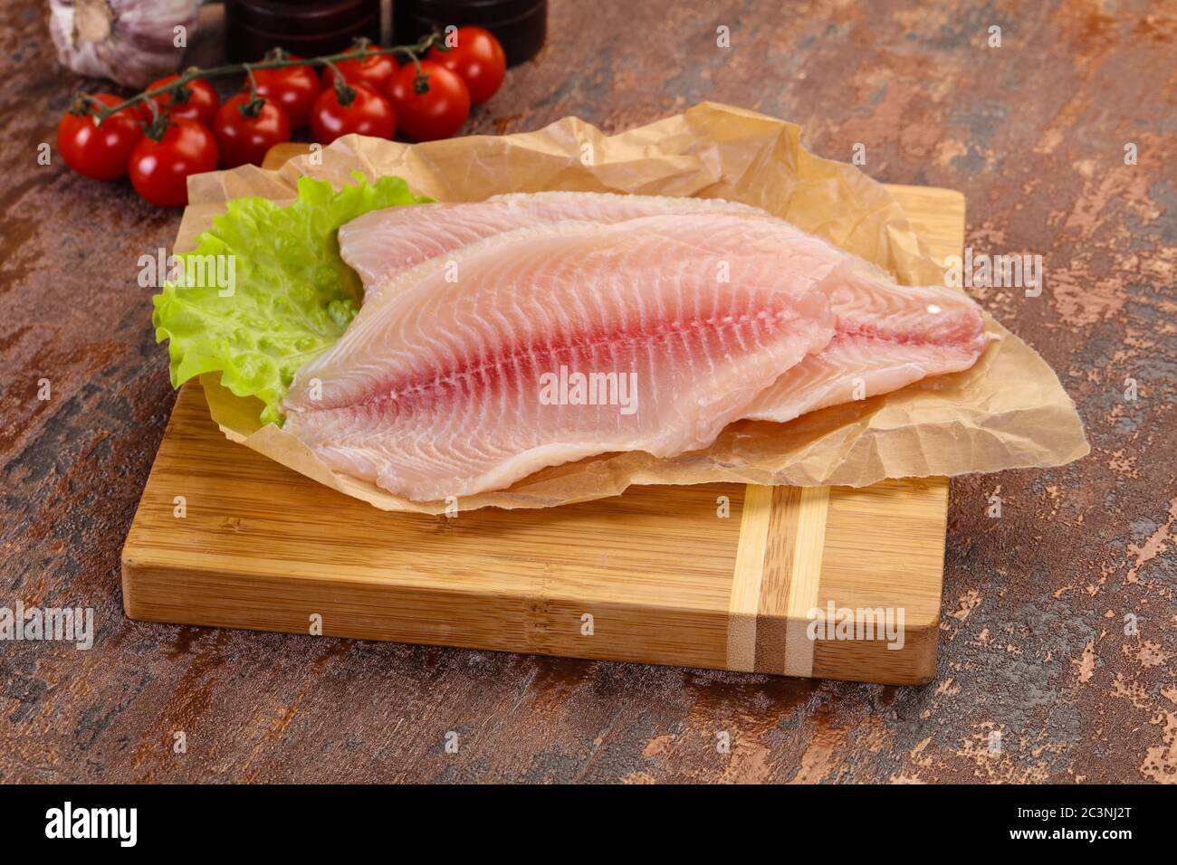 Raw tilapia fish ready for cooking Stock Photo - Alamy