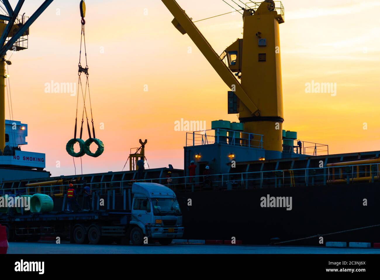 Steel wire rod discharging from ship load onto truck for delivering to ...