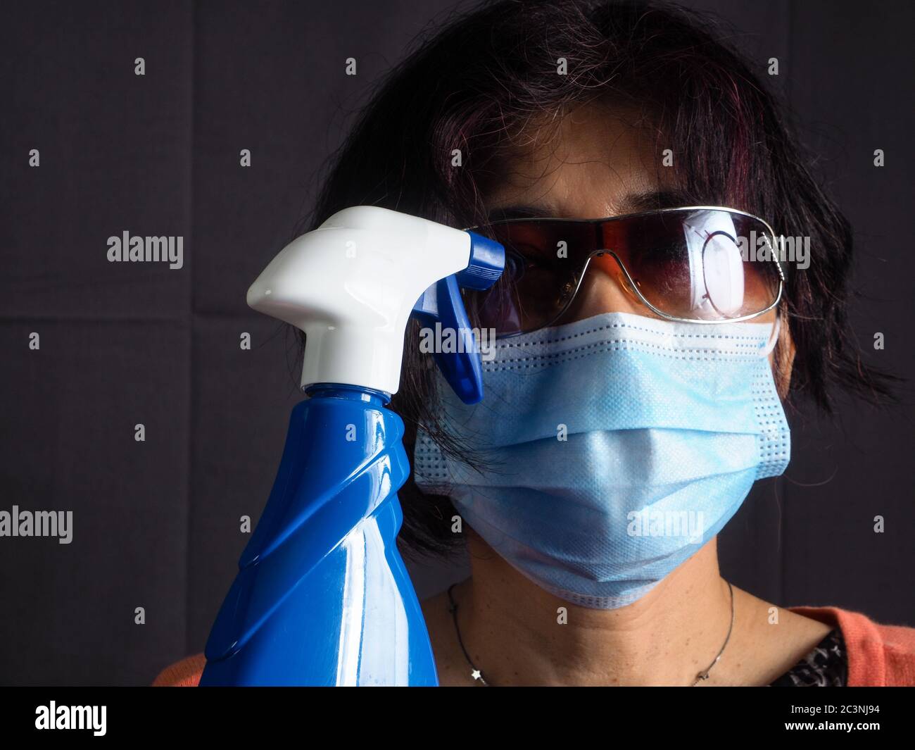 funny humorous adult asian 40s 50s woman wearing protection surgical ...