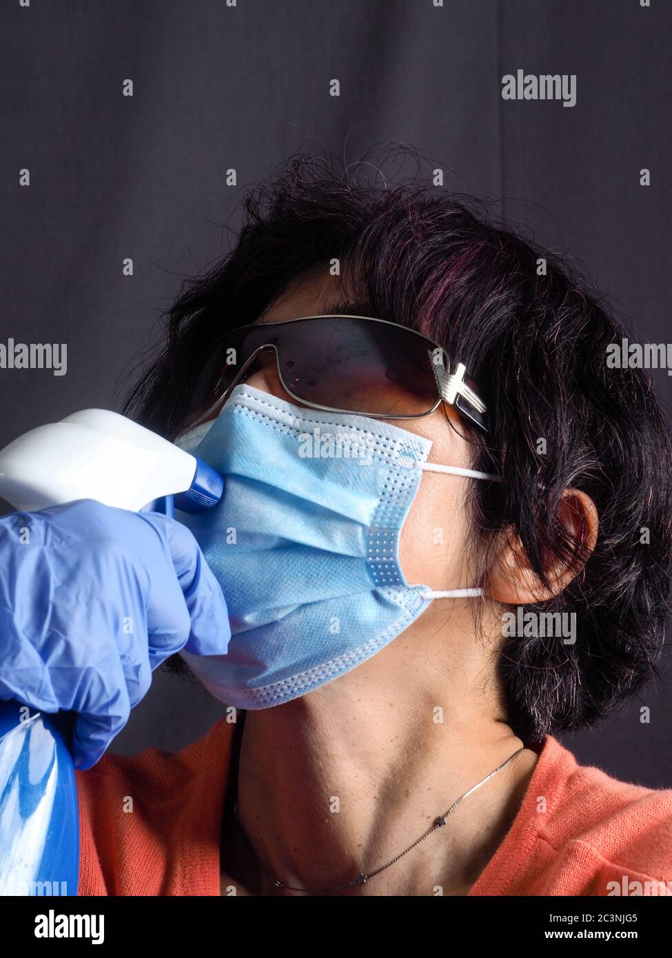 funny humorous adult asian 40s 50s woman wearing protection surgical ...