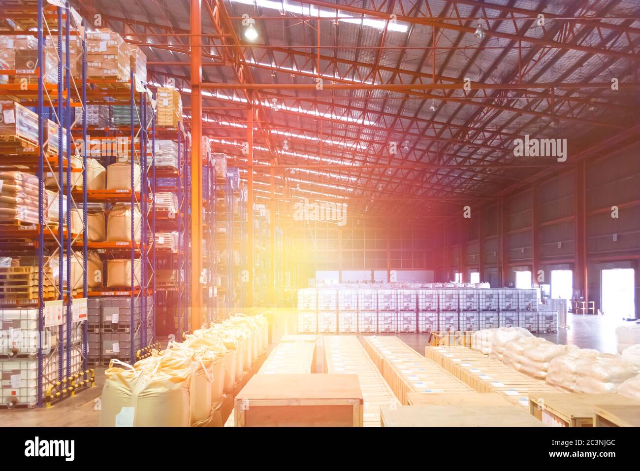 Large distribution warehouse interior, pallets and boxes of cargo stack ...
