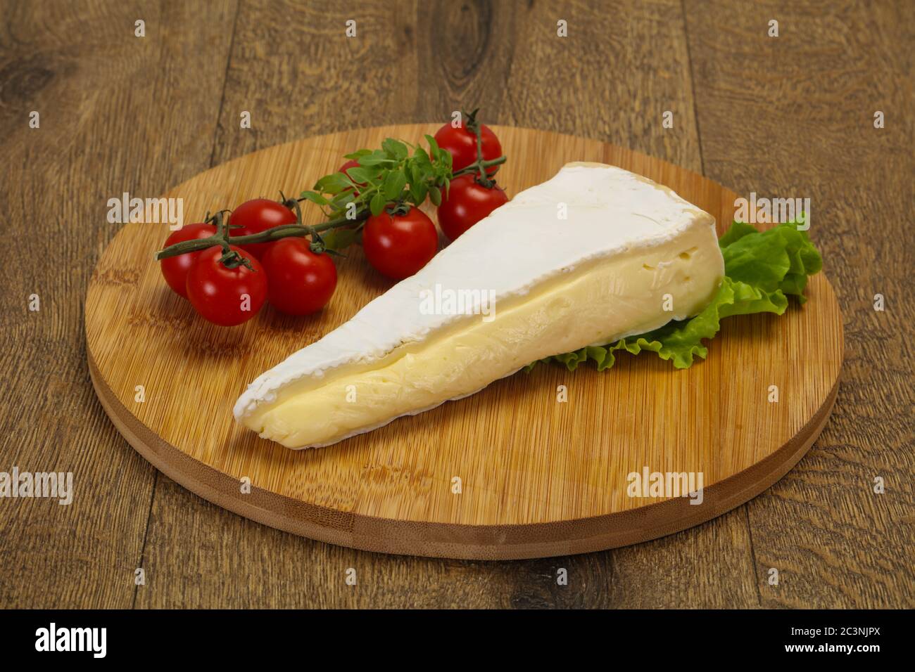 Brie cheese triangle served salad leaves Stock Photo - Alamy