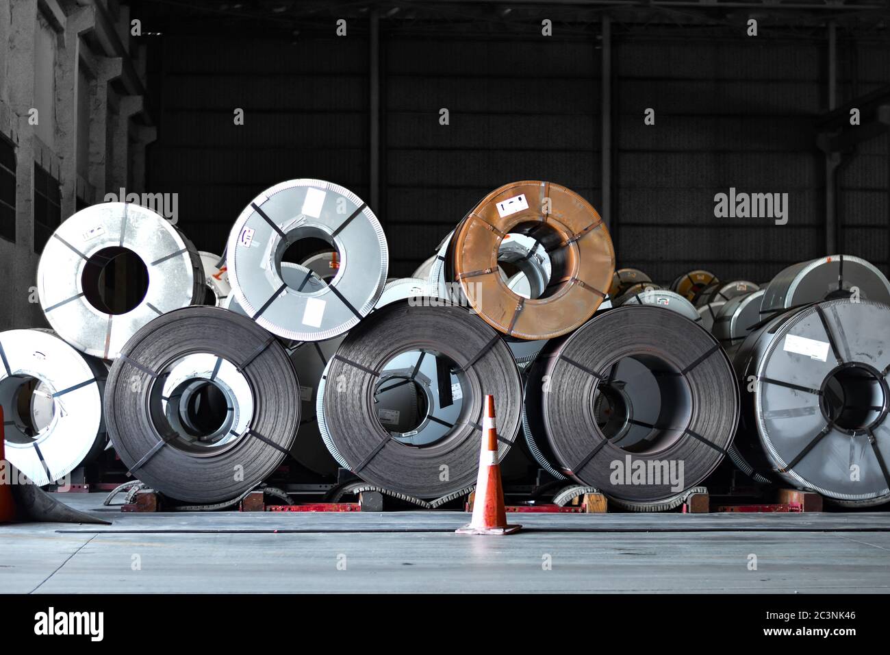 Steel coils on wooden pallets in warehouse stuffing area for container ...