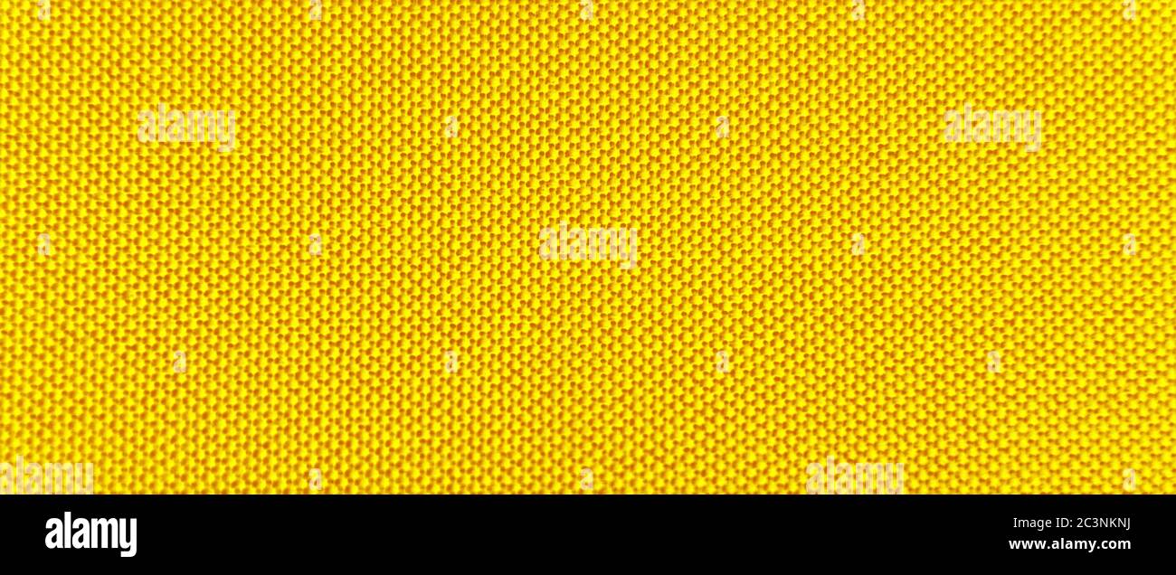 Panoramic shot of a yellow mesh texture-background Stock Photo - Alamy