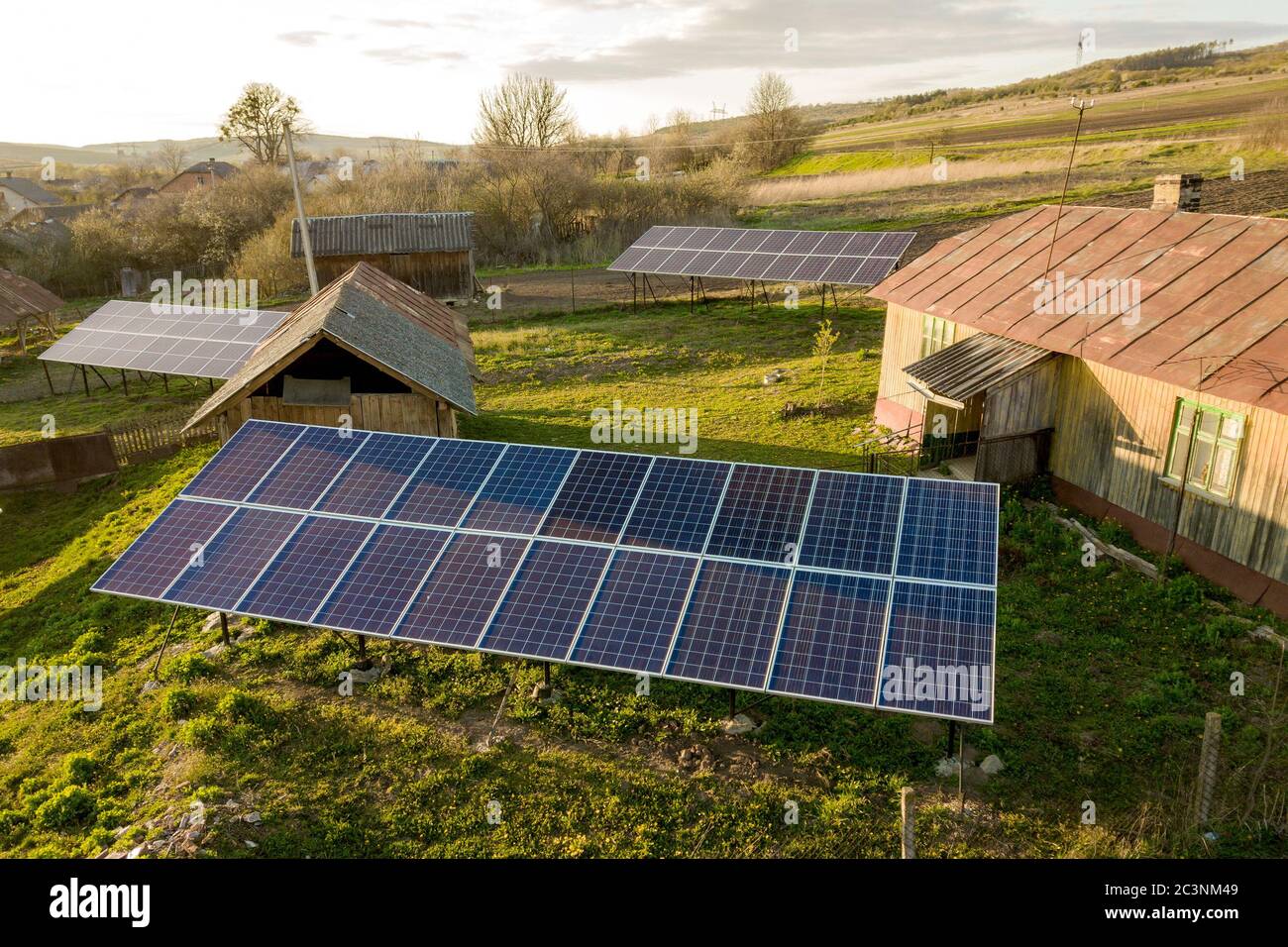 Aerial top down view of solar panels in green rural village yard Stock ...