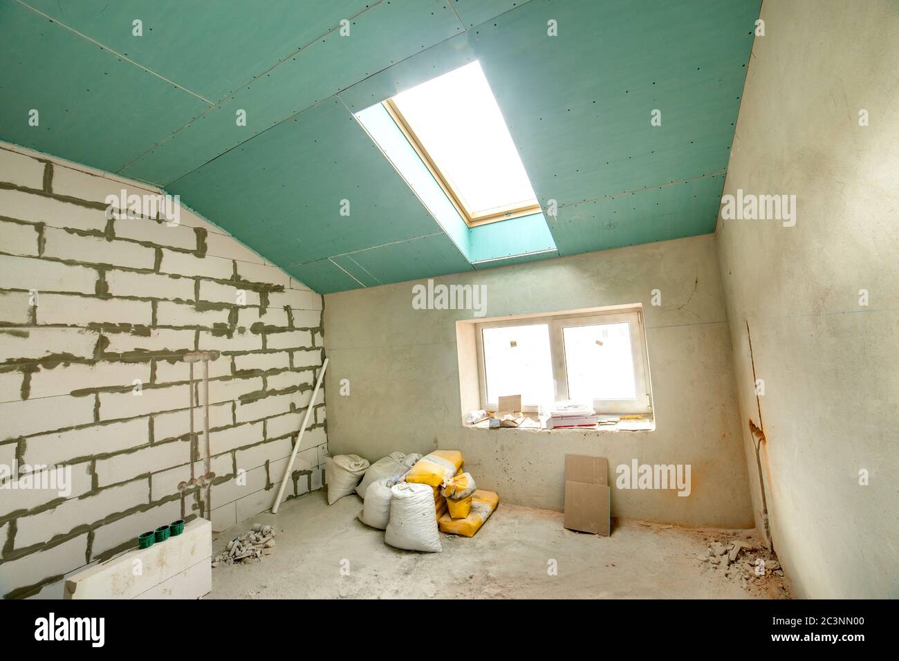 Interior of an apartment room with bare walls and ceiling under ...