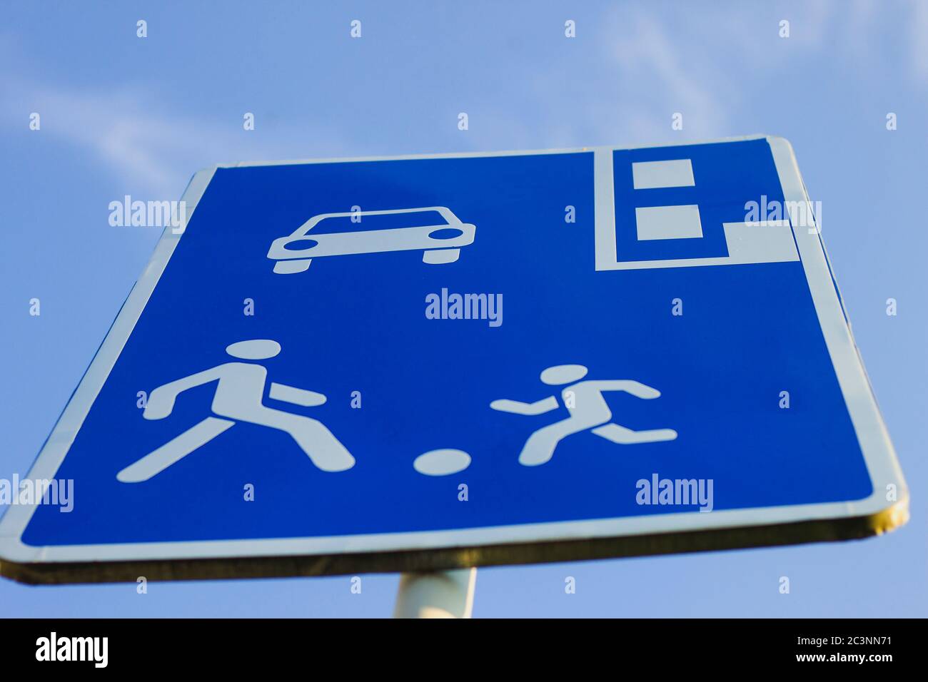 Information road sign, blue rectangular shield with human figures, car ...