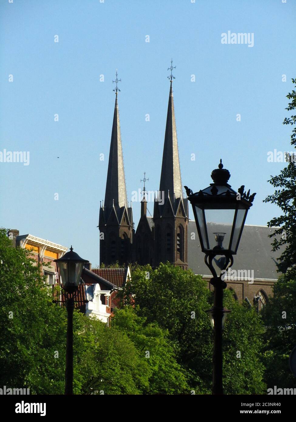AMSTERDAM, NETHERLANDS - Jul 25, 2012: Christian Church with two tall ...