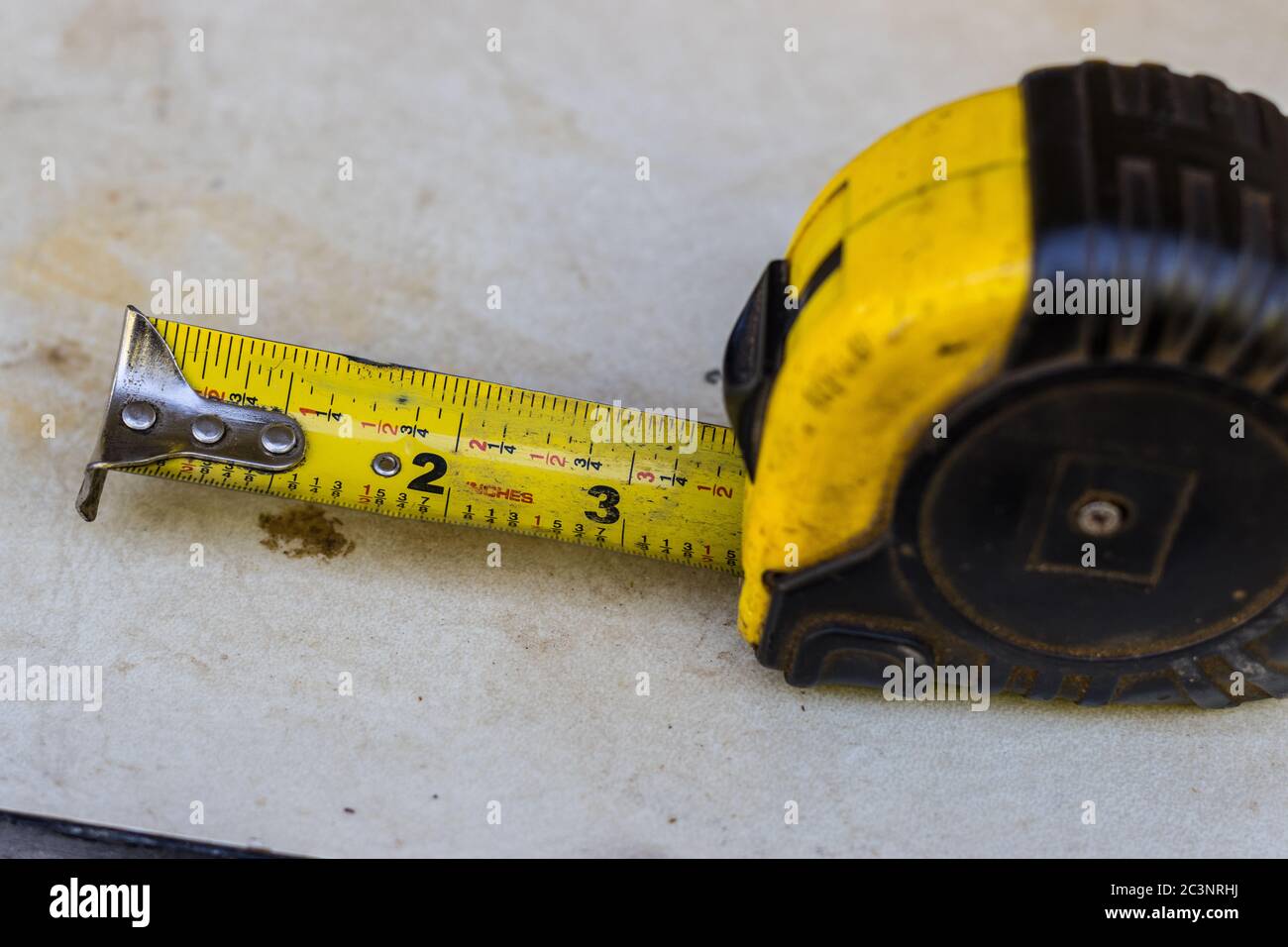 A well used and worn Tape Measure Stock Photo - Alamy