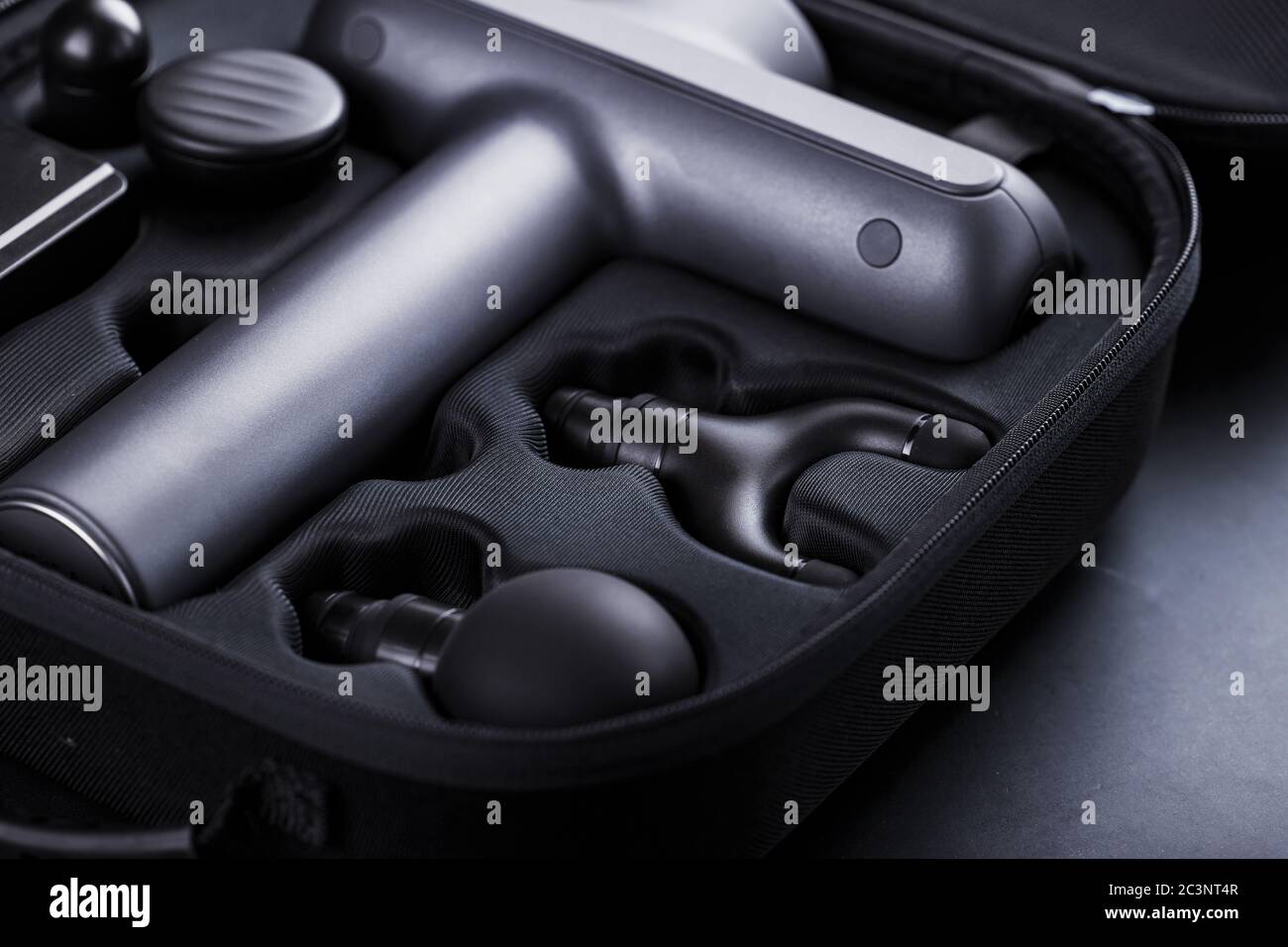 Electric massager Machine for body massage in a case on a black ...