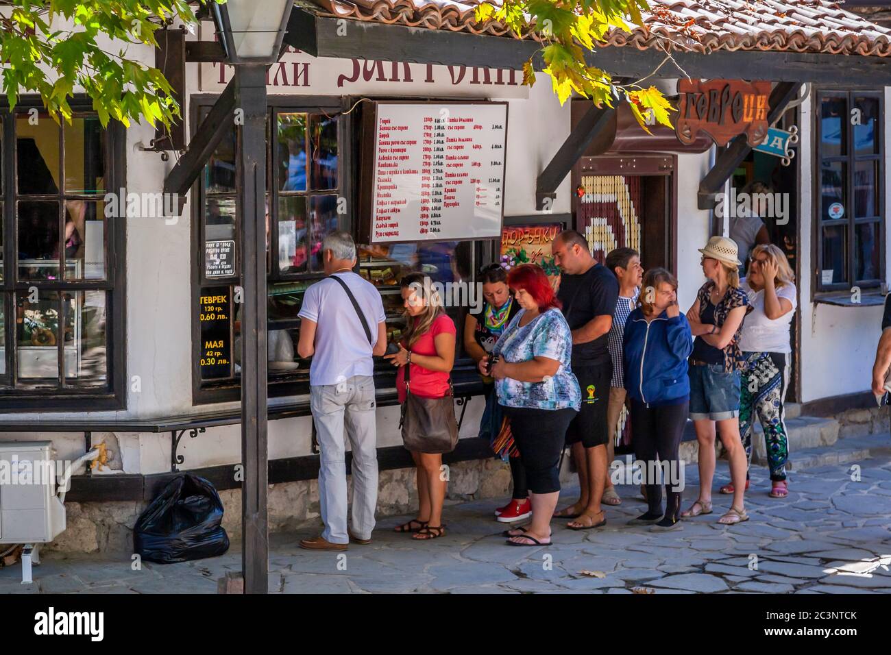 Queue of buyers in front of a bakery in Dobrich, Bulgaria Stock Photo ...