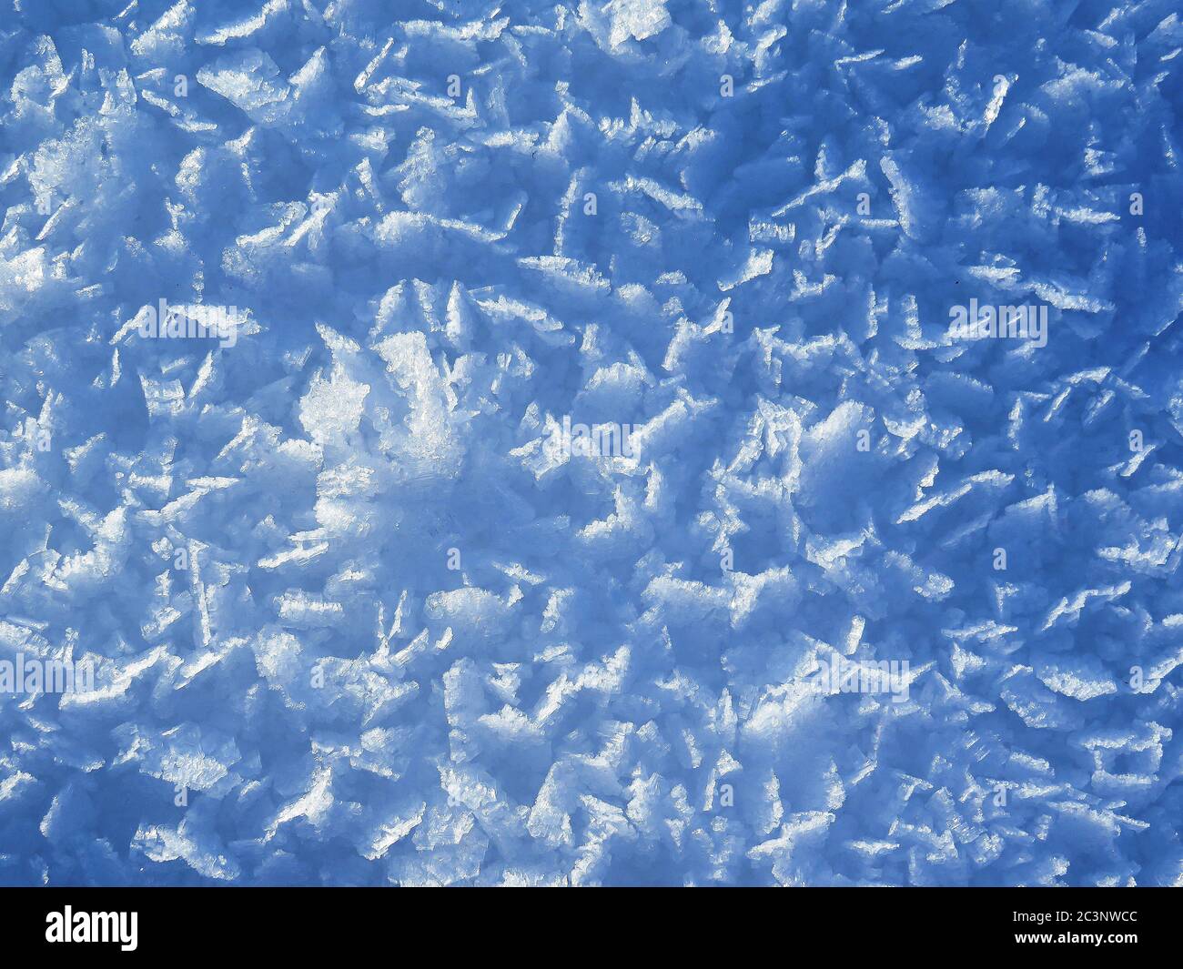 Closeup shot of white snow crystals - good for cold snowy background ...