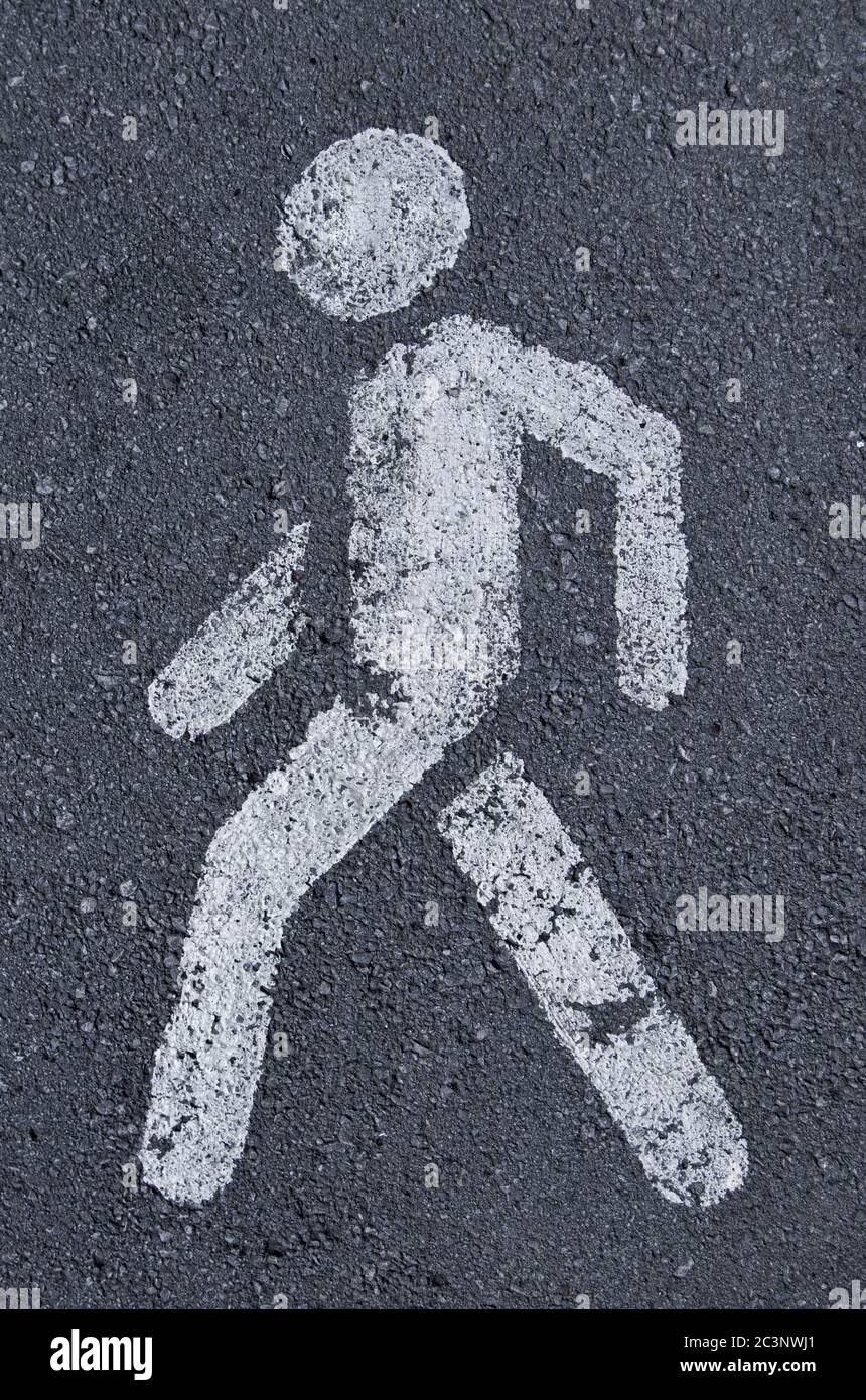 The sign of the footpath on the asphalt, white faded paint Stock Photo ...