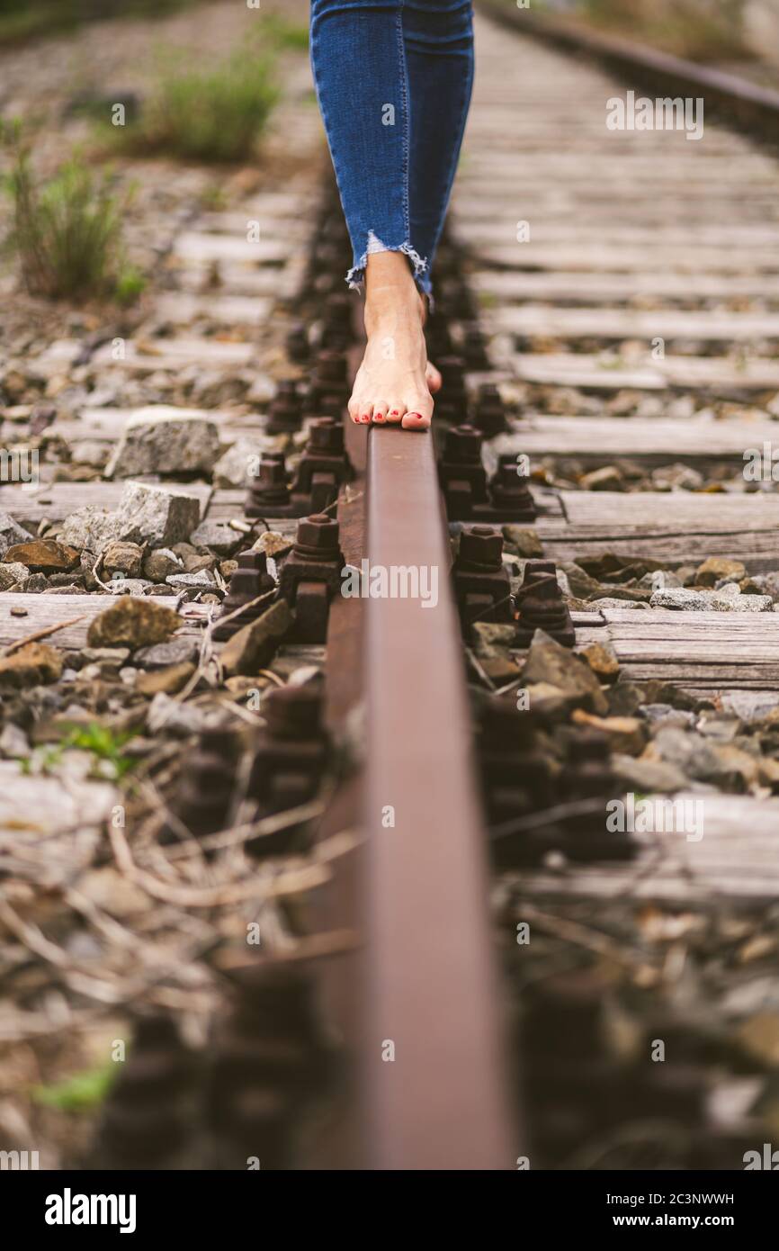 Young woman walking barefoot through hi-res stock photography and ...