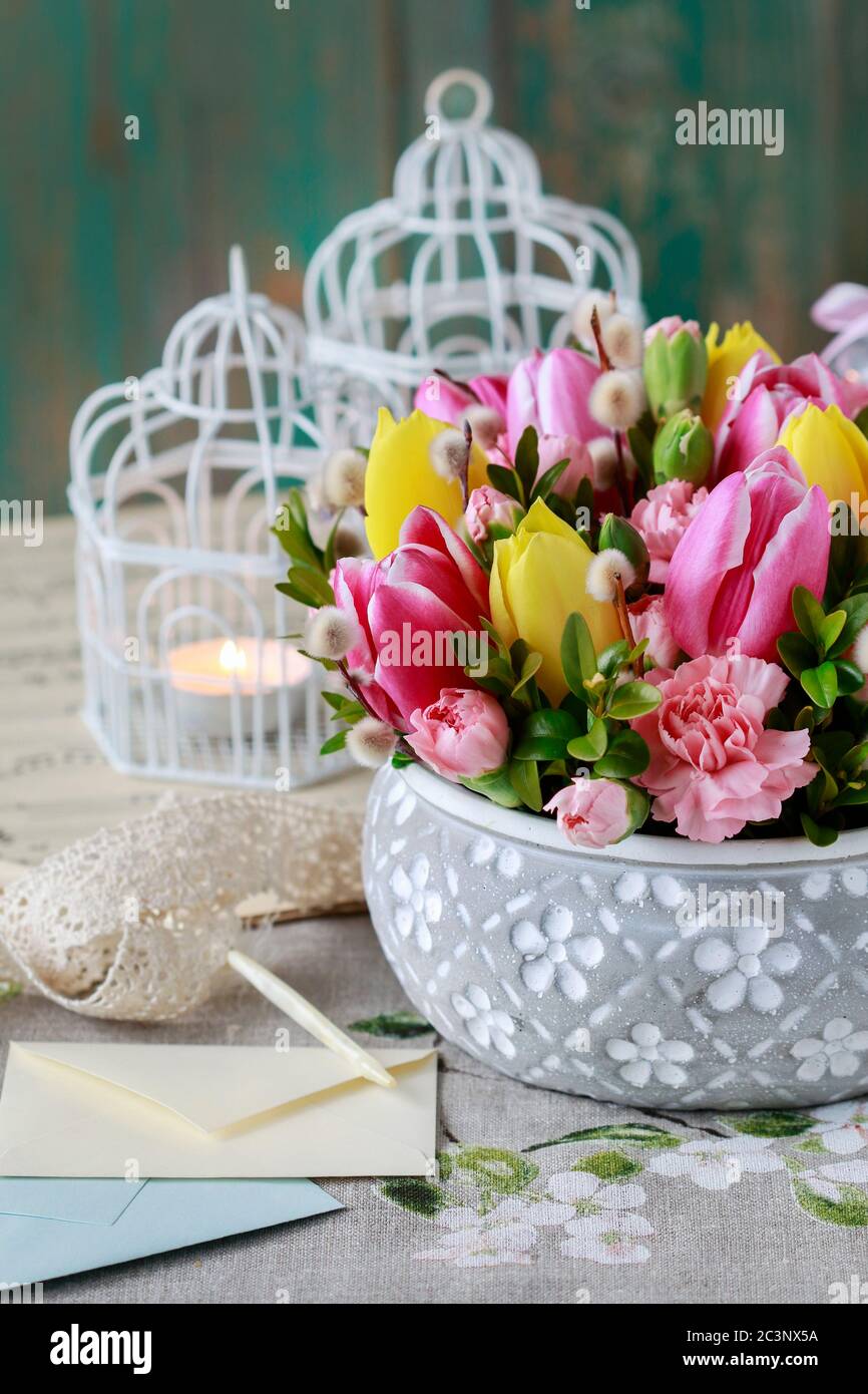 Florist at work: woman shows how to make beautiful floral arrangement ...