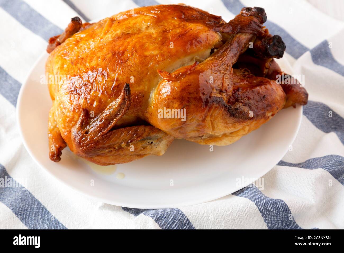 Grilled whole chicken side view hi-res stock photography and images - Alamy