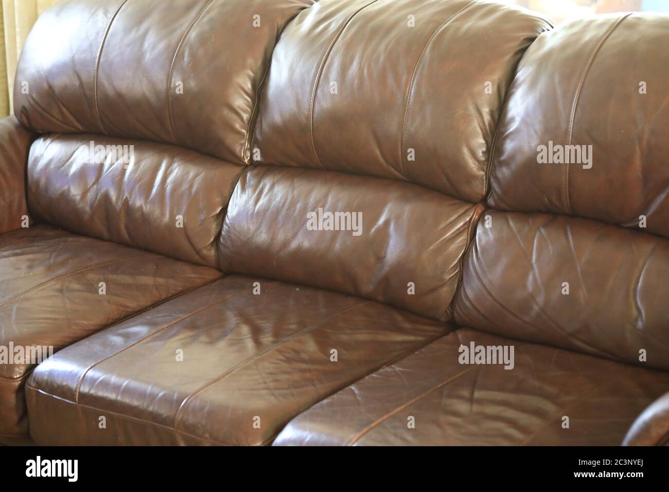 Close up of a leather sofa Stock Photo - Alamy