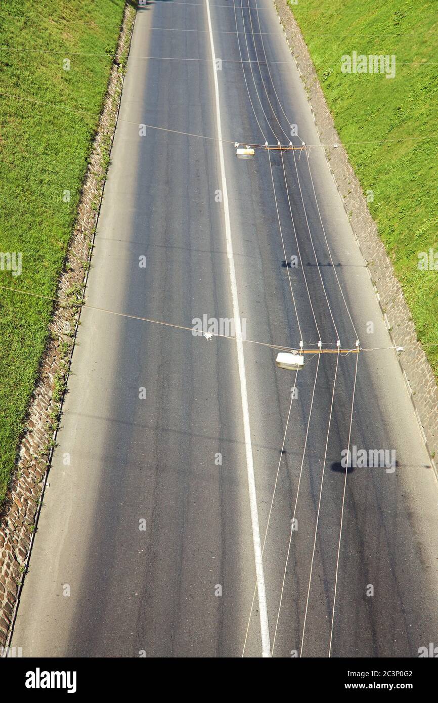 motorway in a city. Empty road without cars. trolley wire Stock Photo ...