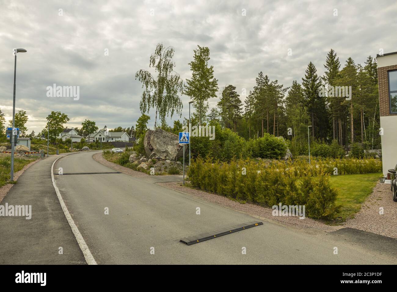 View of speed bump on village street road. Landscape view background ...