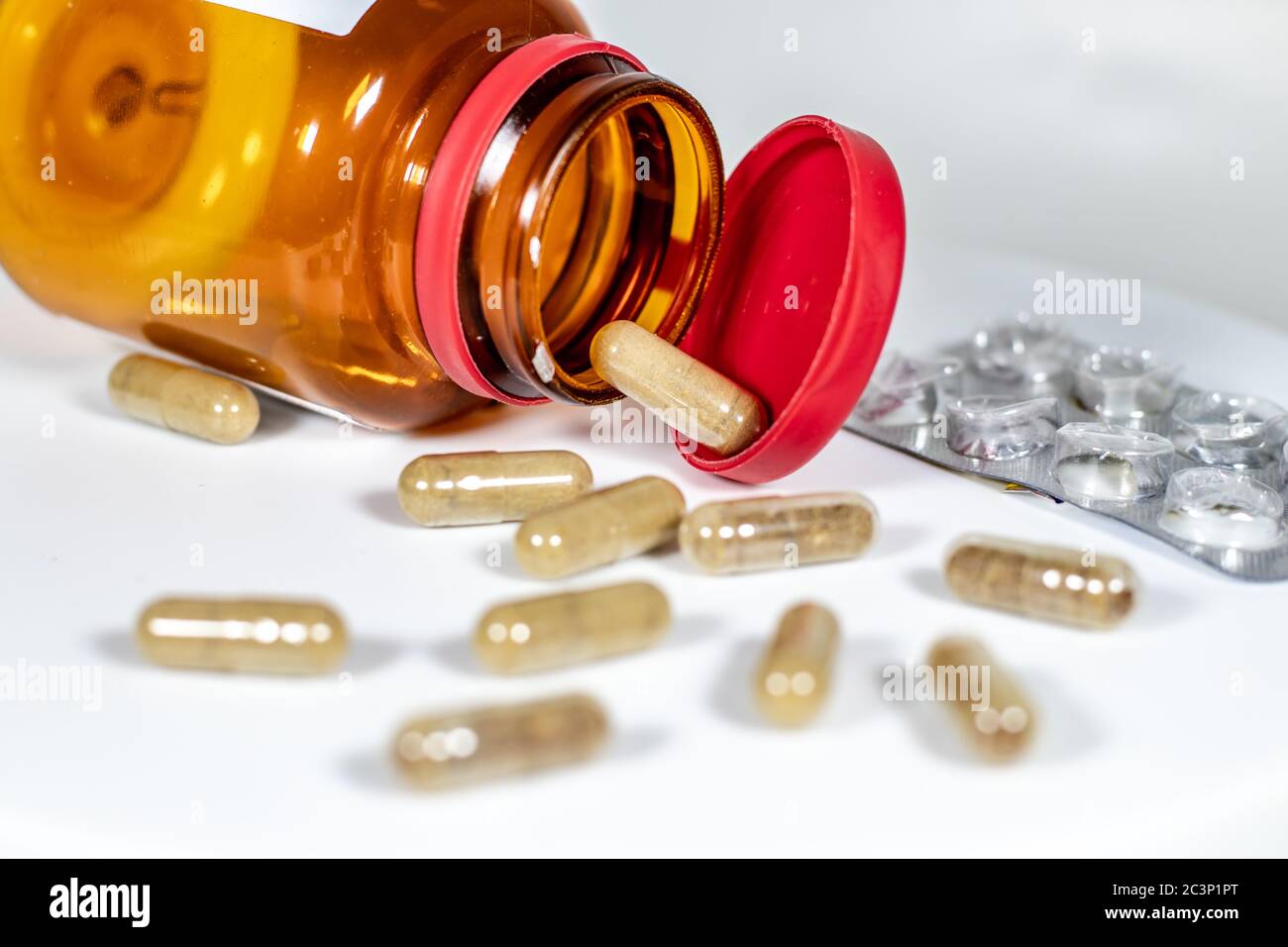 Pharmaceutical medicine, tablets and capsules and bottle in white ...