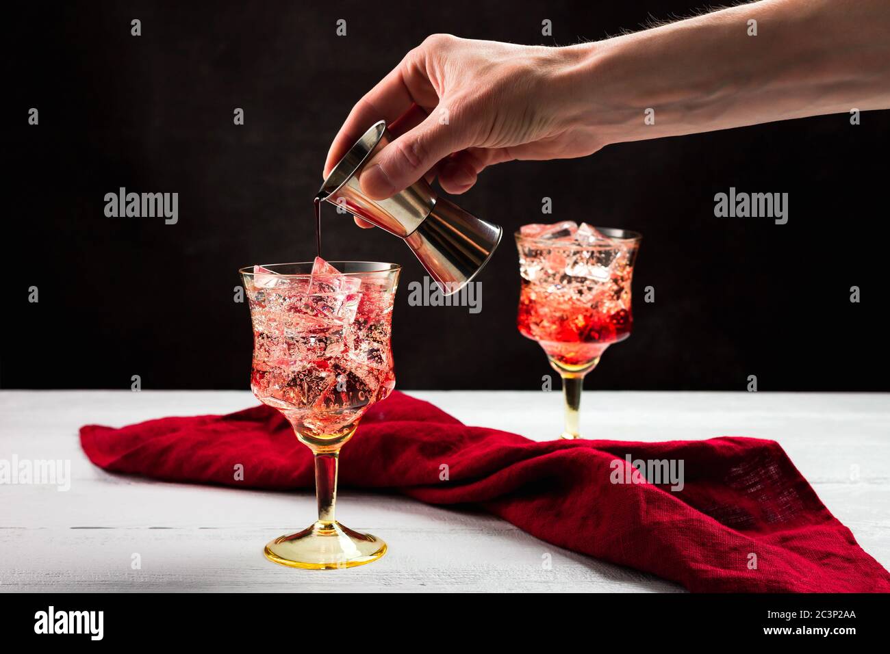 Hand pouring syrup from jigger hi-res stock photography and images - Alamy