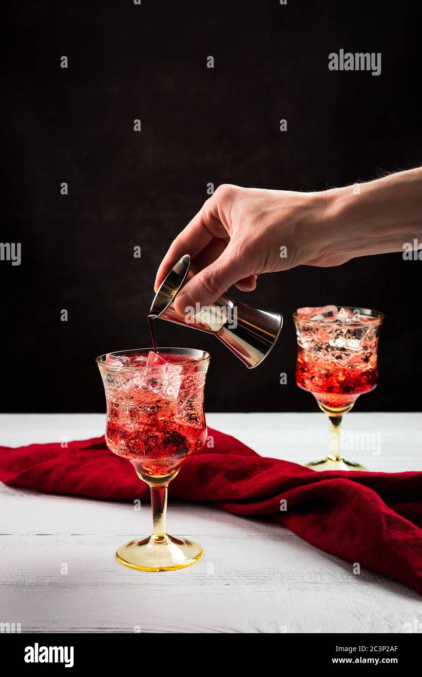 Hand pouring water into another hand hi-res stock photography and ...