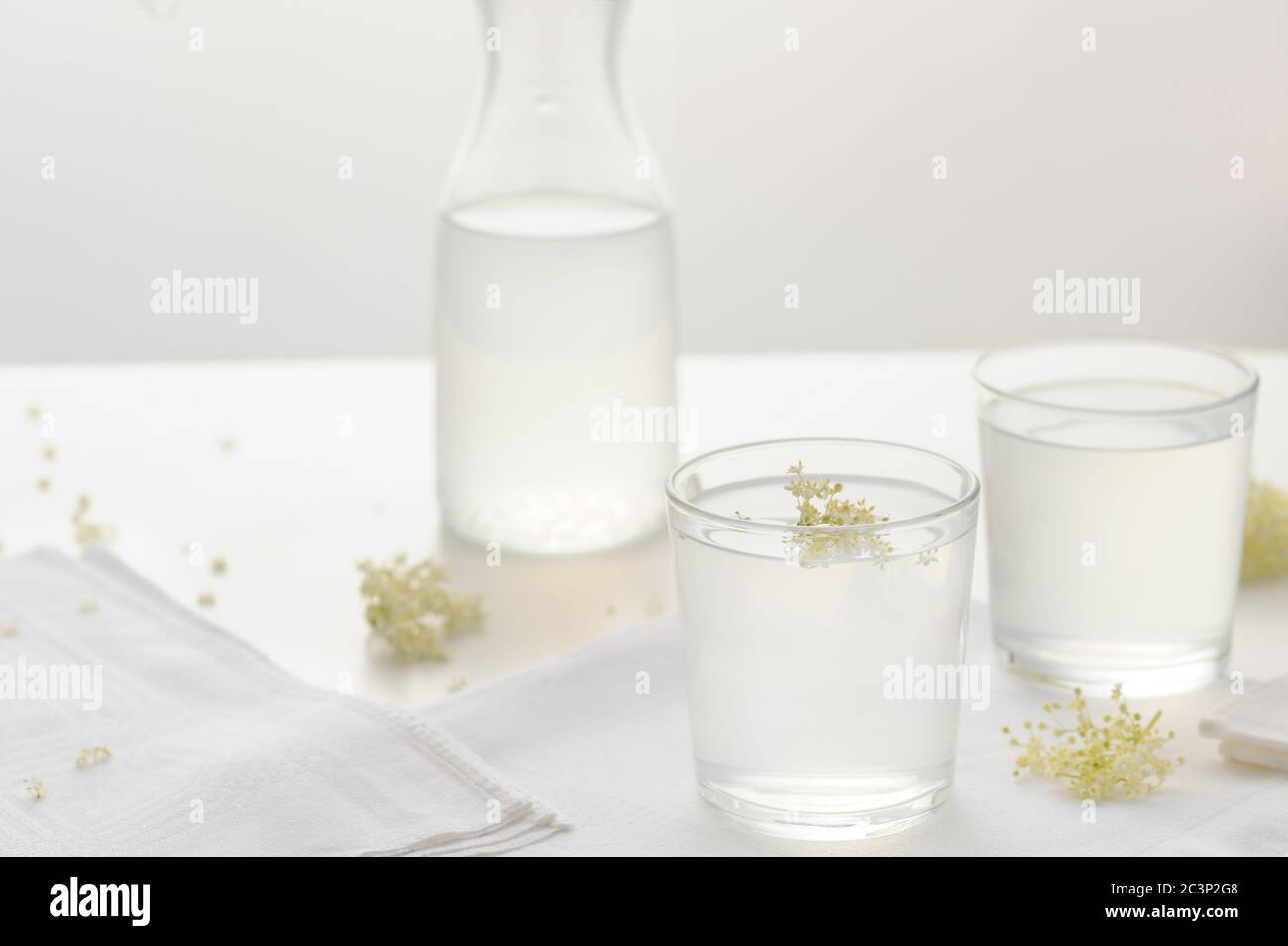 Lemonade with elderflower. Refreshing summer cocktail in the drinking ...
