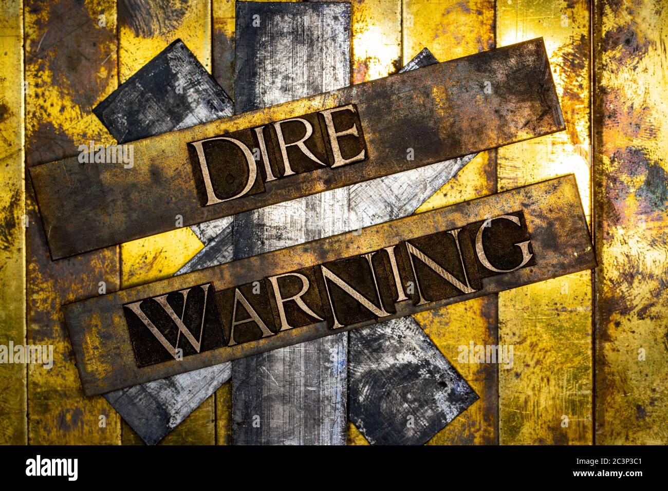 Dire Warning text formed with real authentic typeset letters on vintage ...