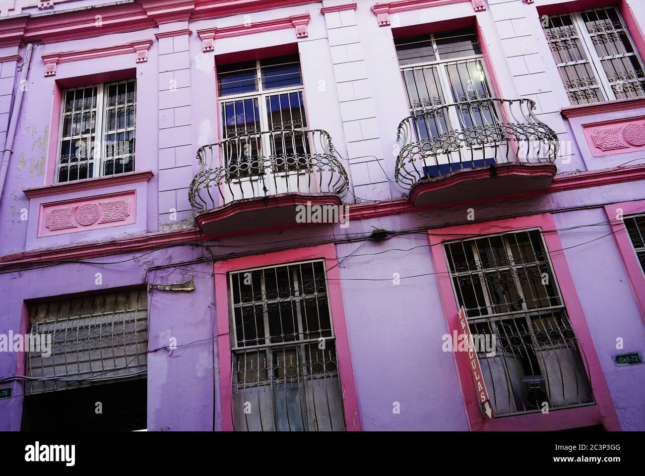 Low angle shot of a pink building facade Stock Photo - Alamy