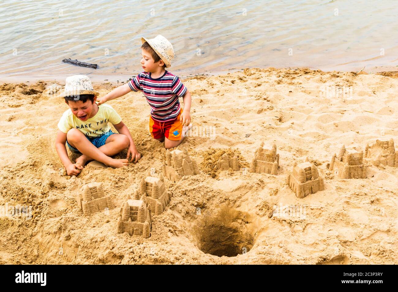 POZNAN, POLAND - May 10, 2020: Two small kids including crying boy ...