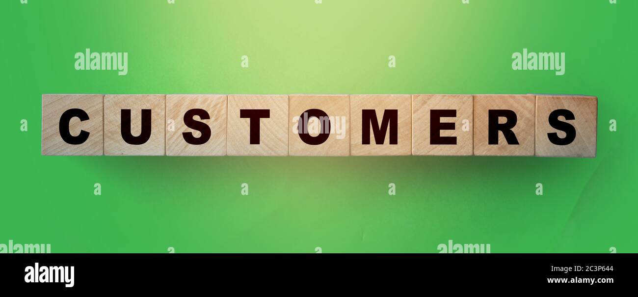 Customers word on wooden blockson green gradient background. B2C ...