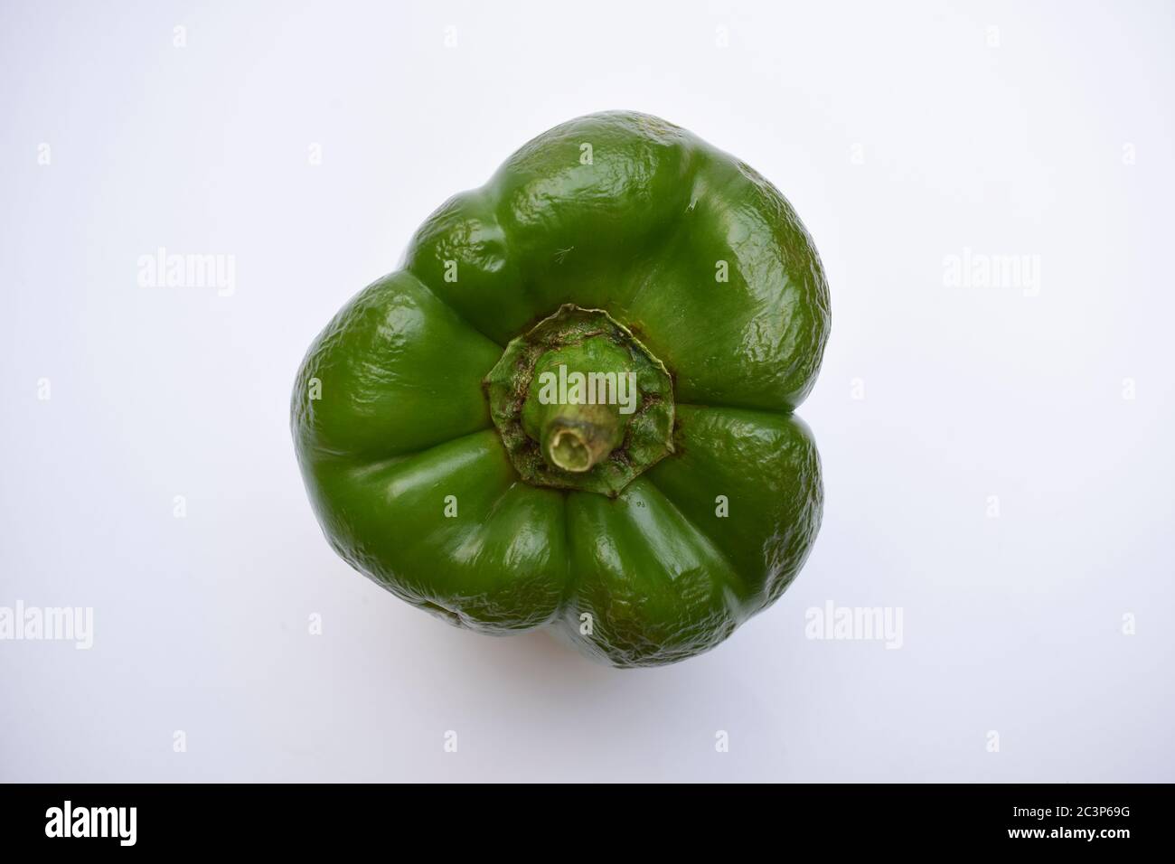 Top view of Green capsicum or green bellpepper on white background ...