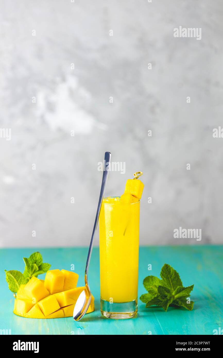 Refreshing summer cocktails made of mango, cold drink or a drink with ...