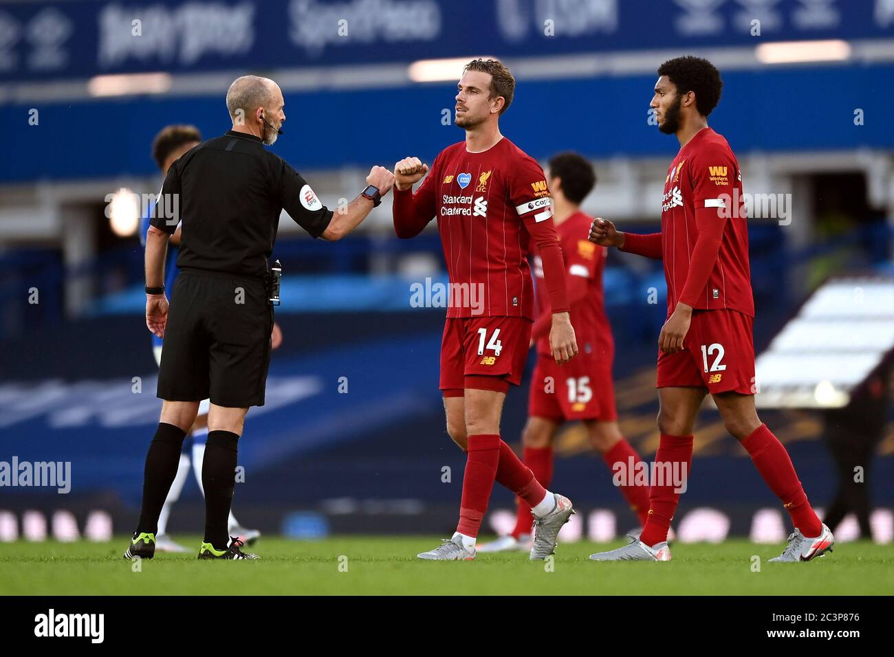 Liverpool's Jordan Henderson and referee Mike Dean after the Premier ...
