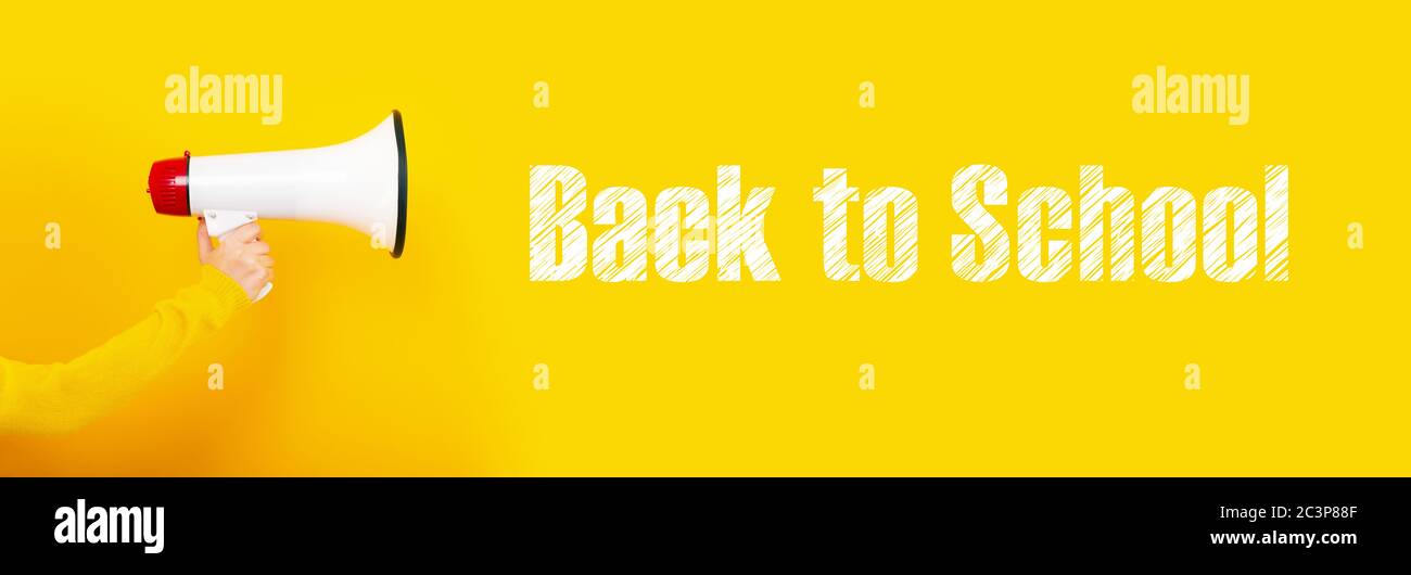 megaphone with inscription back to school, panoramic image, attention ...