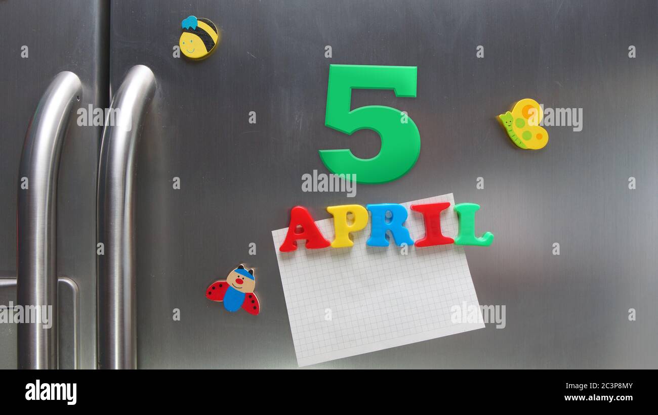 April 5 calendar date made with plastic magnetic letters holding a note ...