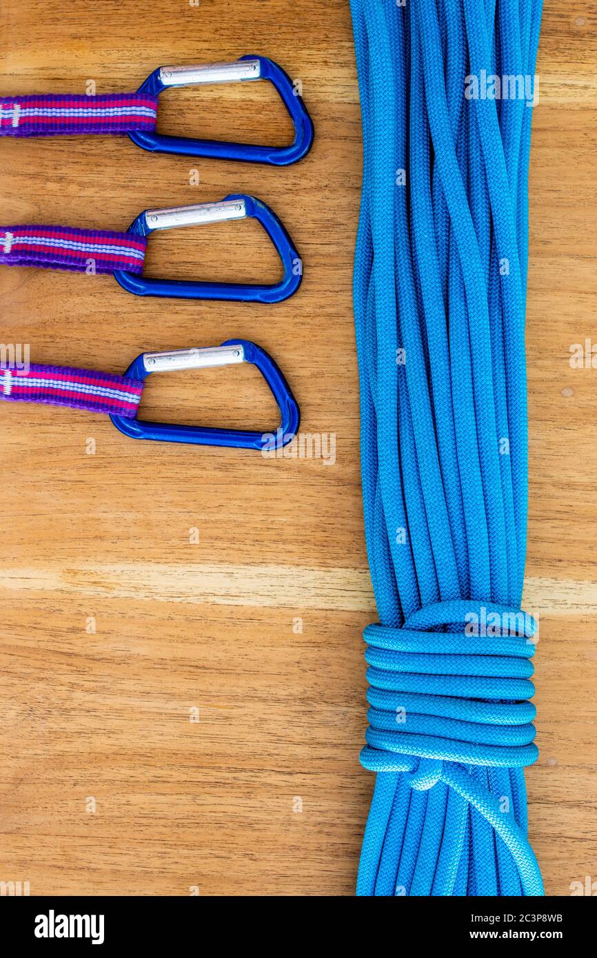 Overhead shot of blue climbing rope and quickdraws under the light ...