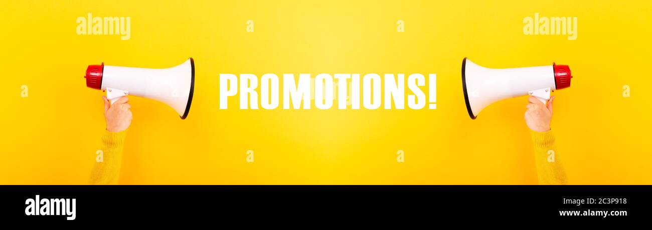 megaphones in female hands, promotions concept panoramic image Stock ...
