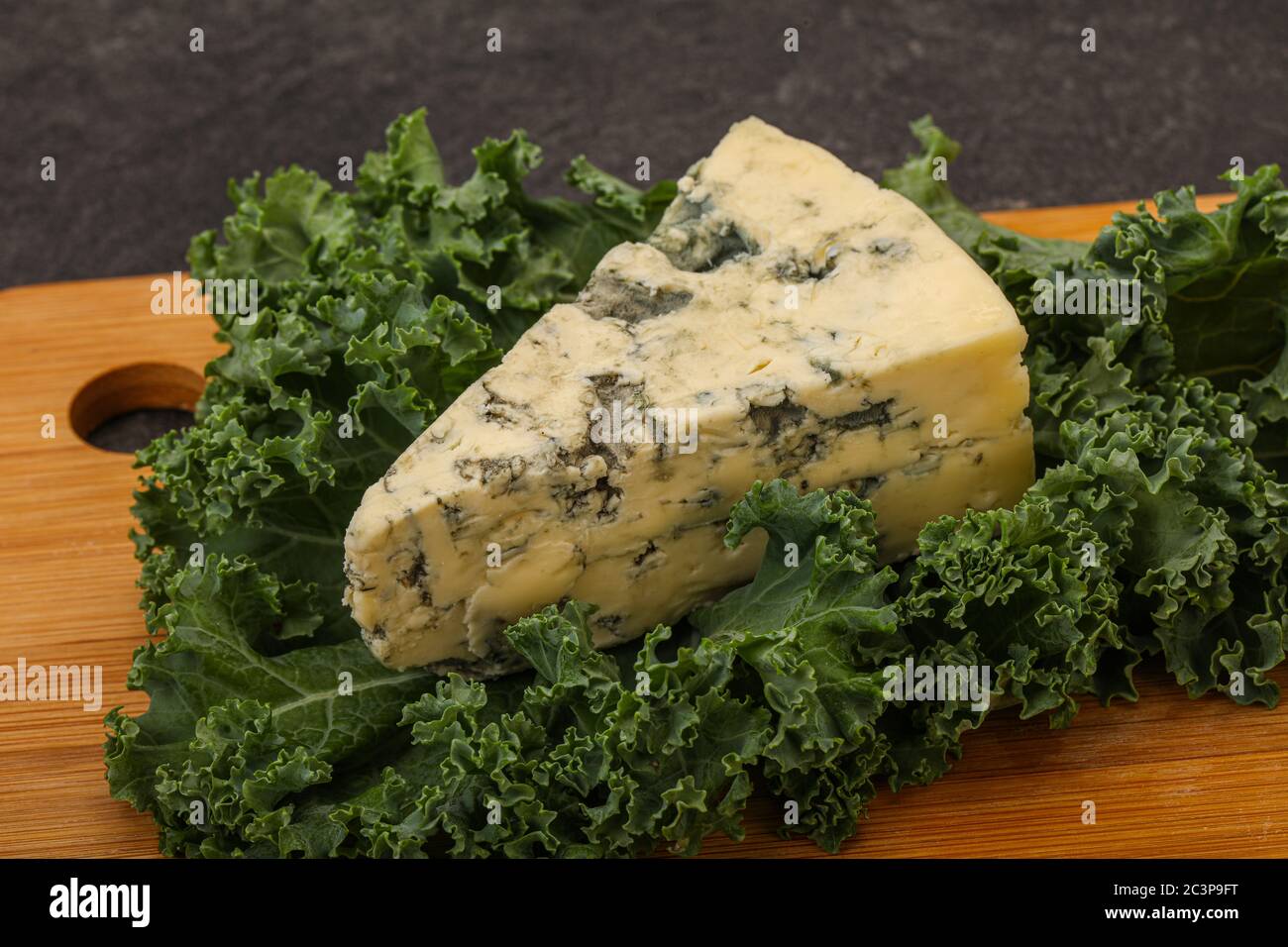 Dairy Blue cheese triangle with mold Stock Photo - Alamy