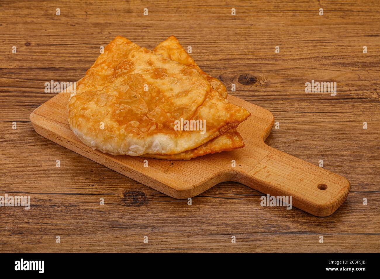 Homemade caucasian juicy cheburek with meat Stock Photo - Alamy