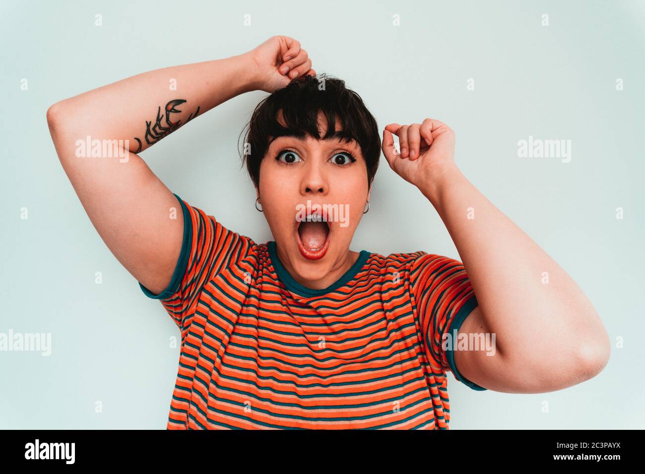 Self-portrait of a caucasian female with an exciting and shocked facial ...