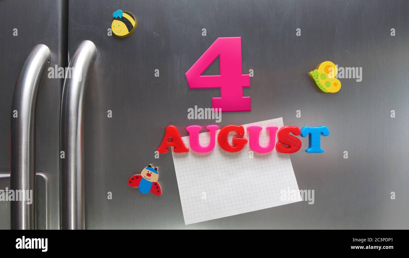 August 4 calendar date made with plastic magnetic letters holding a ...