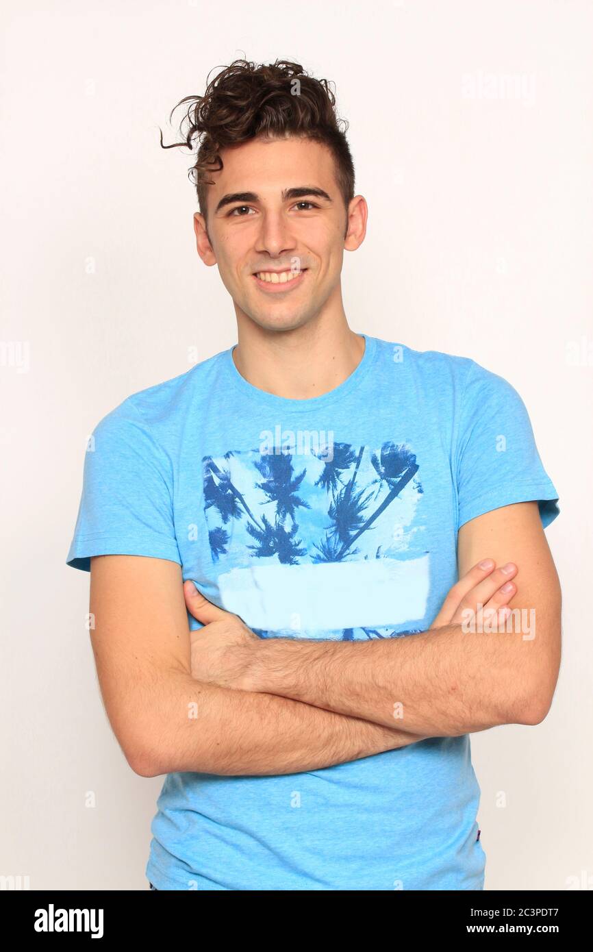 Attractive male model with short hair posing in studio on isolated ...