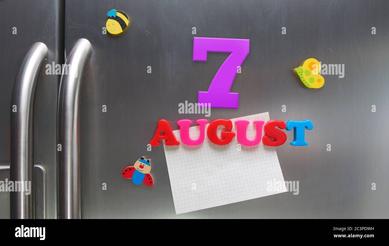 August 7 calendar date made with plastic magnetic letters holding a ...