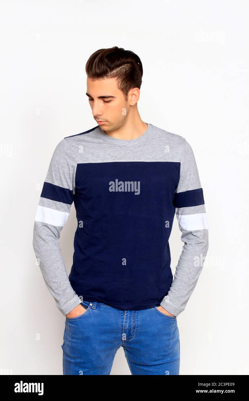 Attractive male model with short hair posing in studio on isolated ...